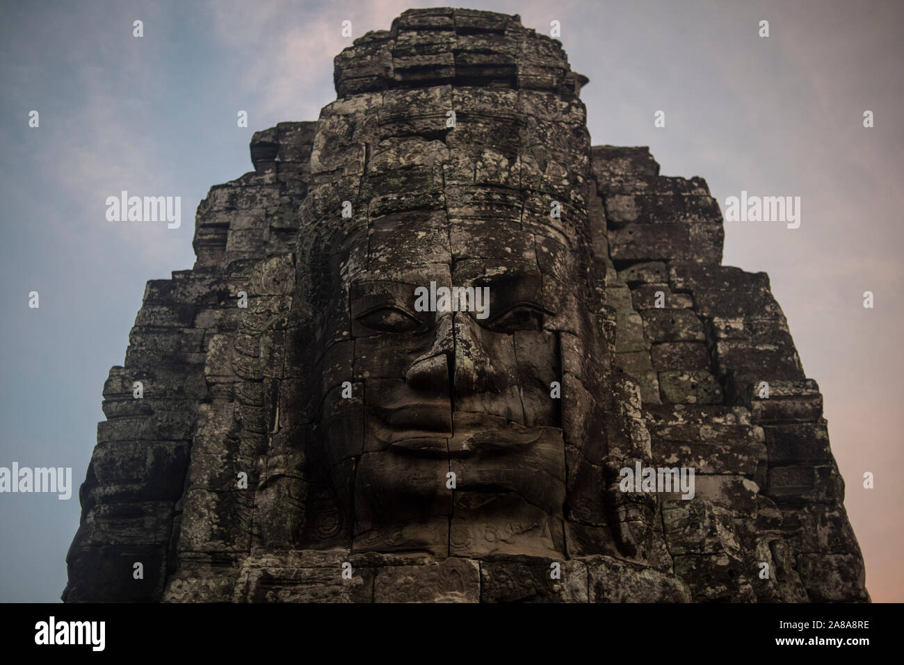 Stone carved Buddha head in Bayon at the Angkor Thom temple in Angkor ...