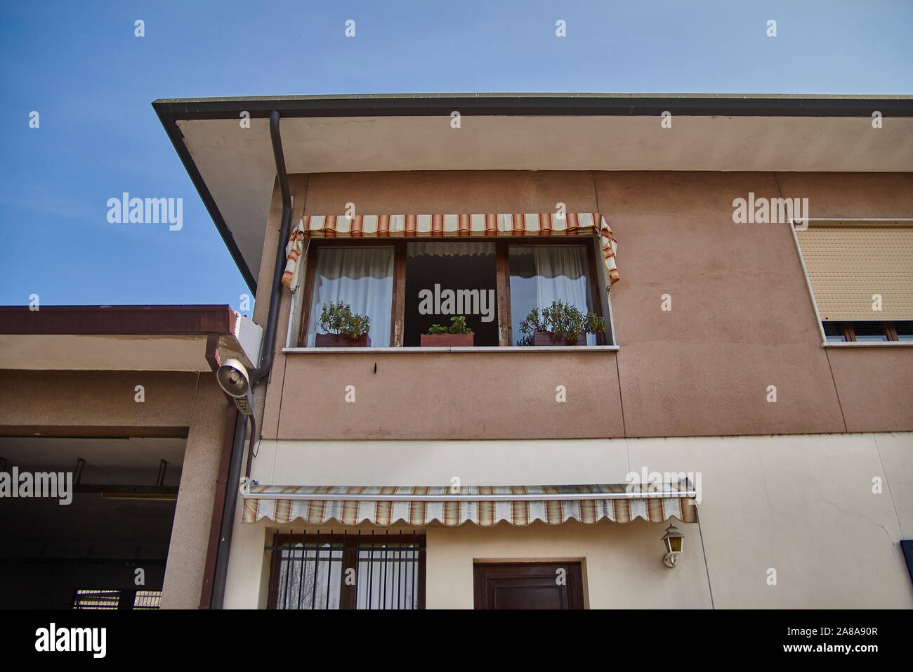 Detail of a balcony with an open window Stock Photo - Alamy