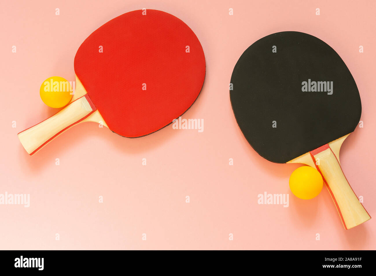 Black and red tennis ping pong rackets and orange balls isolated on a ...