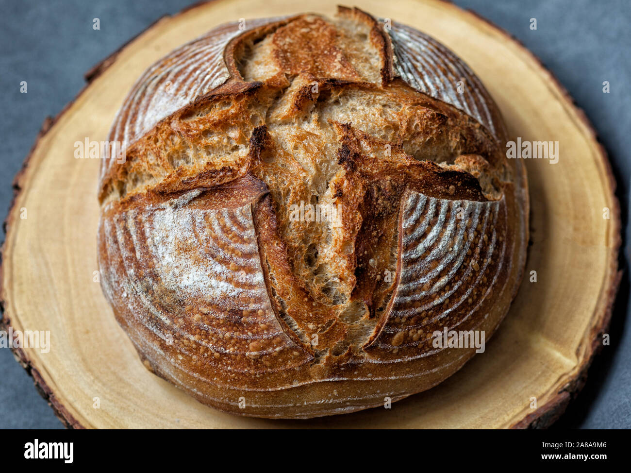Artisan loaf of traditional Homemade sourdough Boule bread with crust ...
