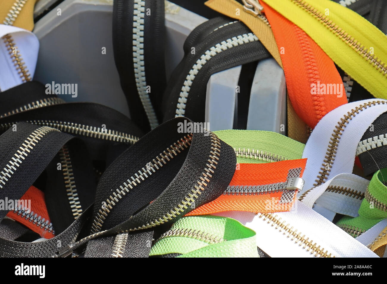 Pile of colourful zippers used in fashion industry for sewing Stock ...