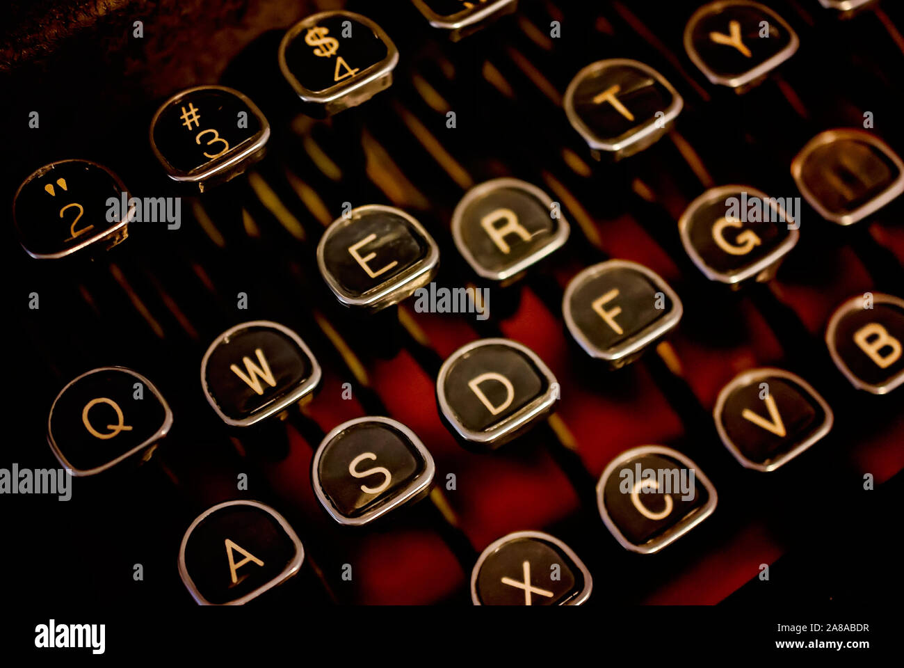 The glass-topped keys of a vintage 1940s Royal KMM typewriter are ...