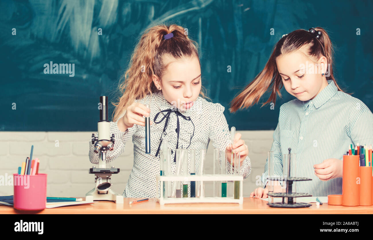 biology education. students doing biology experiments with microscope ...