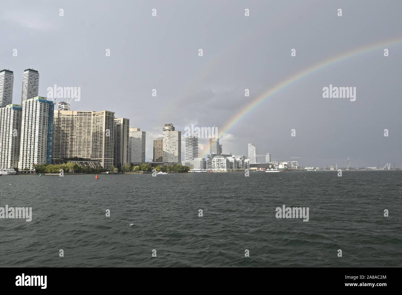 A Rainbow over the city of Toronto, Canada and Lake Ontario as seen ...