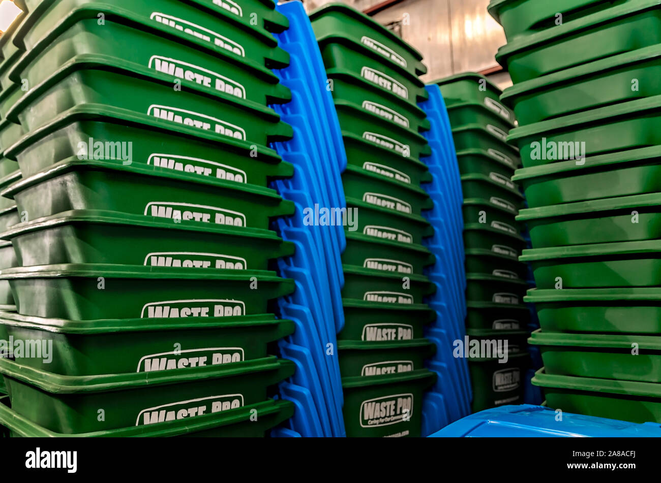 Residential trash cans are stacked at Waste Pro, March 18, 2016, in ...