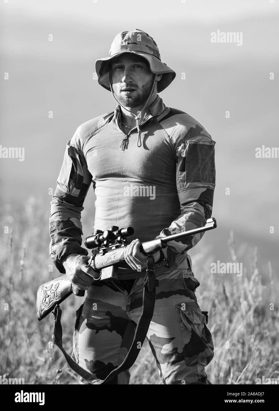 Hunter hold rifle. Hunter mountains landscape background. Focus and ...