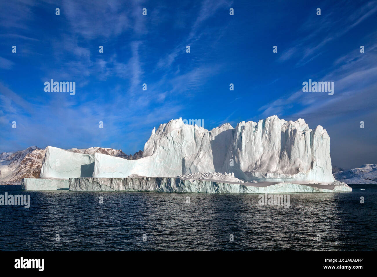 Large iceberg floating in Scoresbysund in eastern Greenland in the late ...