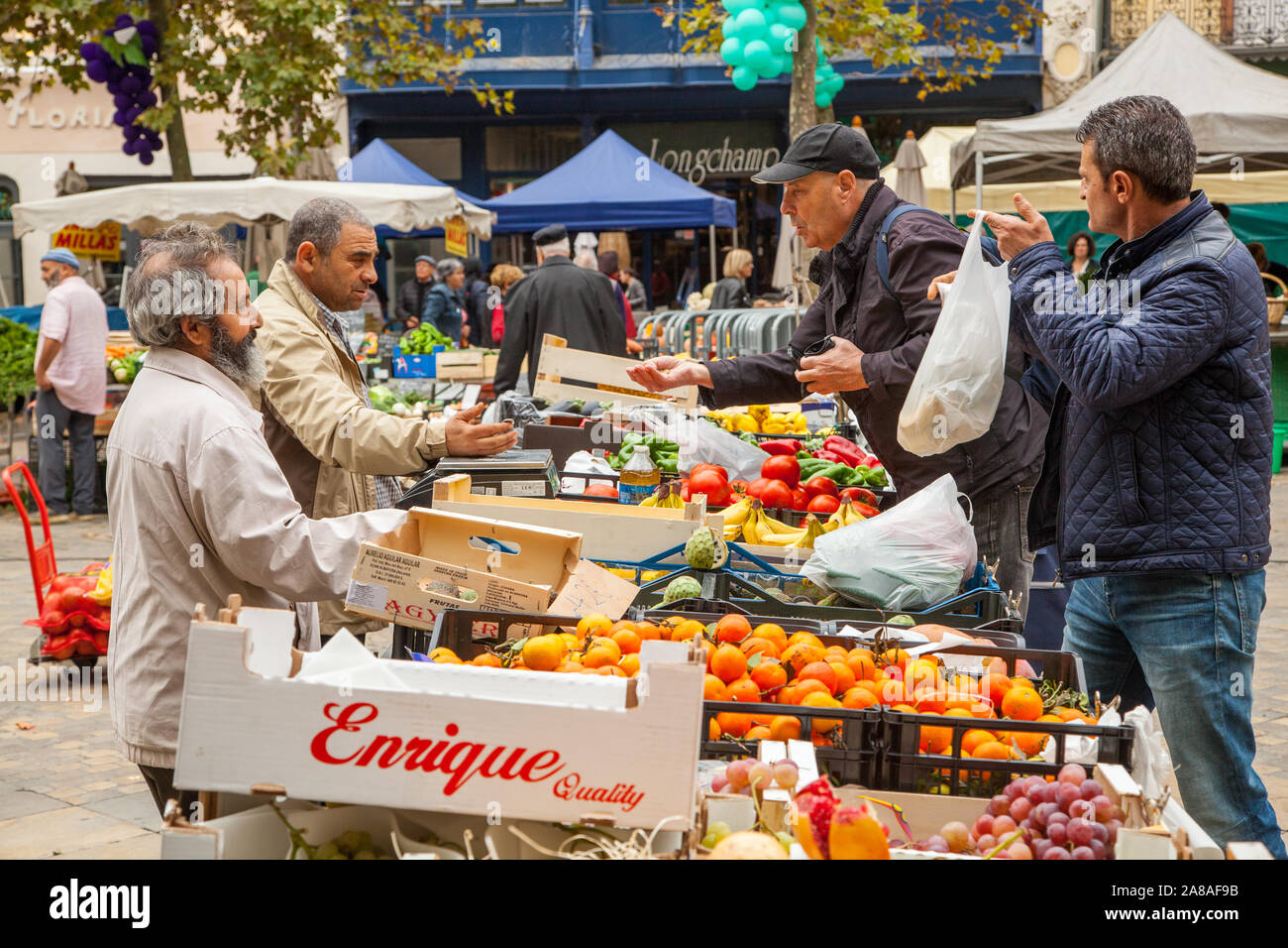 Men women people buying fresh fruit and vegetables from a market stall ...