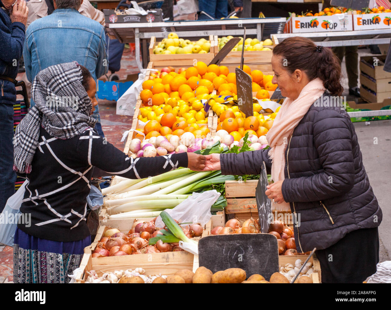 Men women people buying fresh fruit and vegetables from a market stall ...