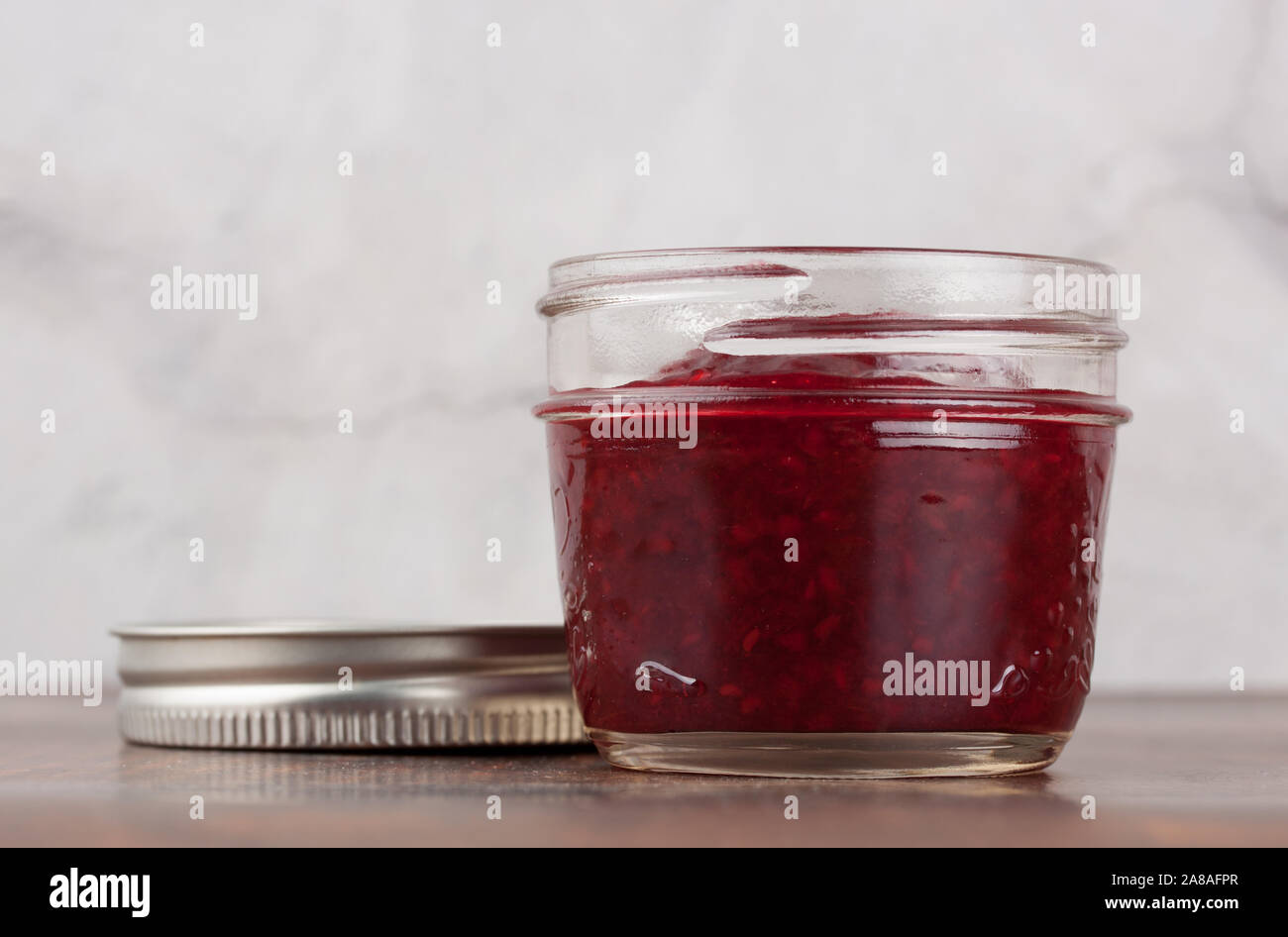 Delicious homemade raspberry jam in a reusable glass jar Stock Photo ...
