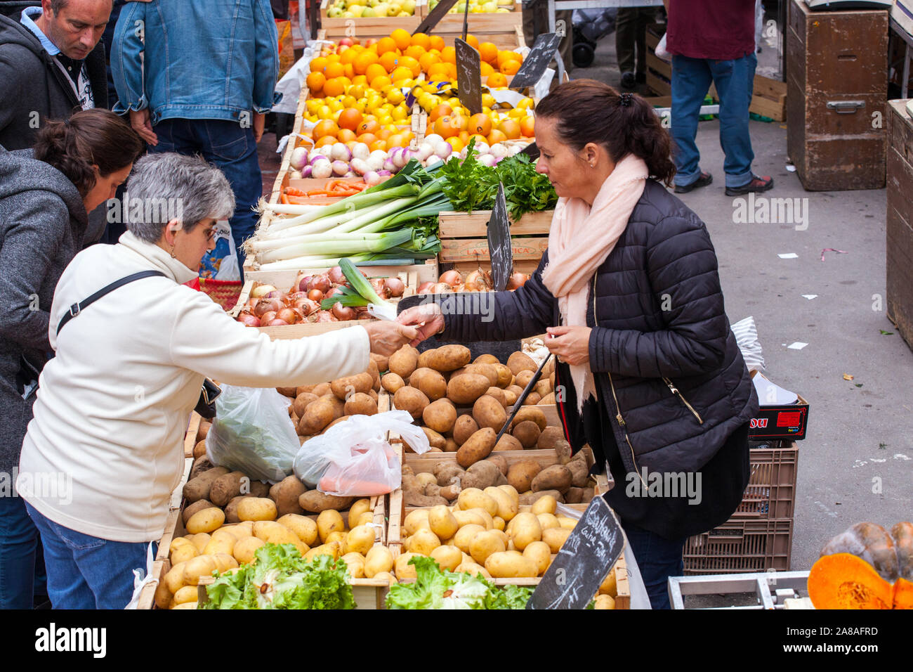 People buying fruit and vegetables at market stall hi-res stock ...