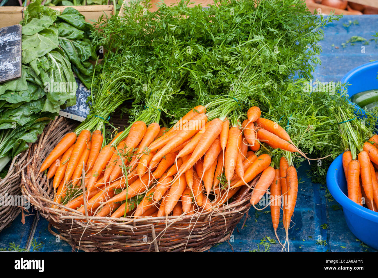 Vegetables on a market stall selling fresh home grown produce Stock ...