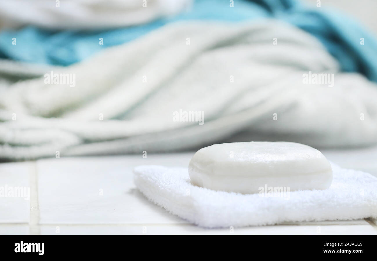 Soap and cloth for washing in a bathroom Stock Photo - Alamy
