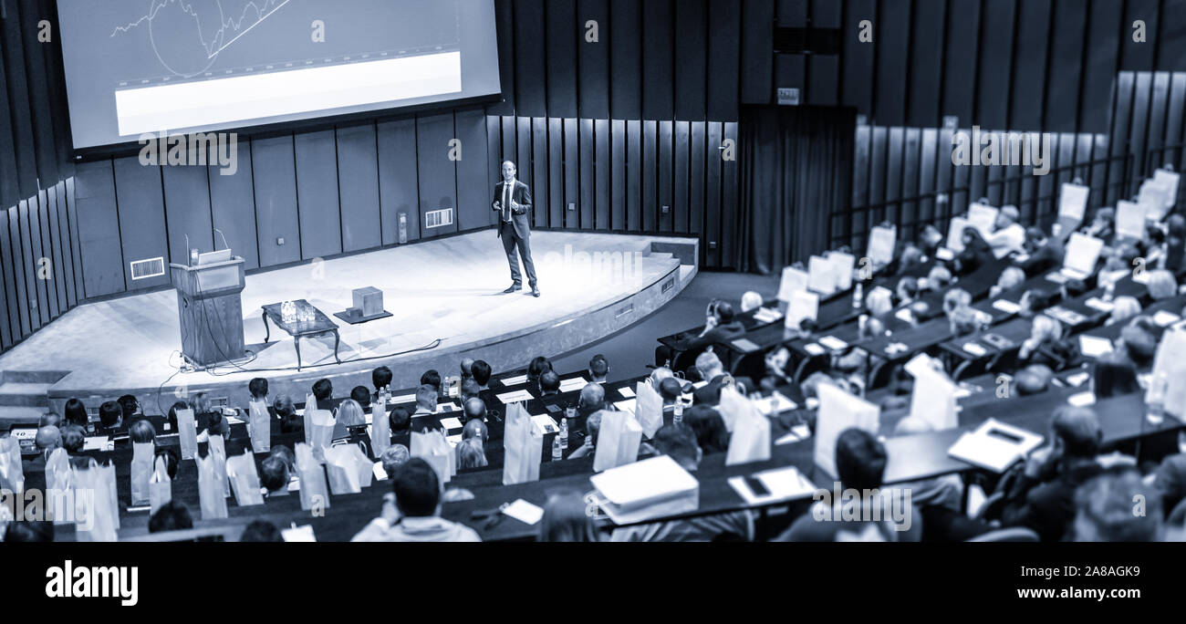 Speaker giving presentation on business conference event Stock Photo ...