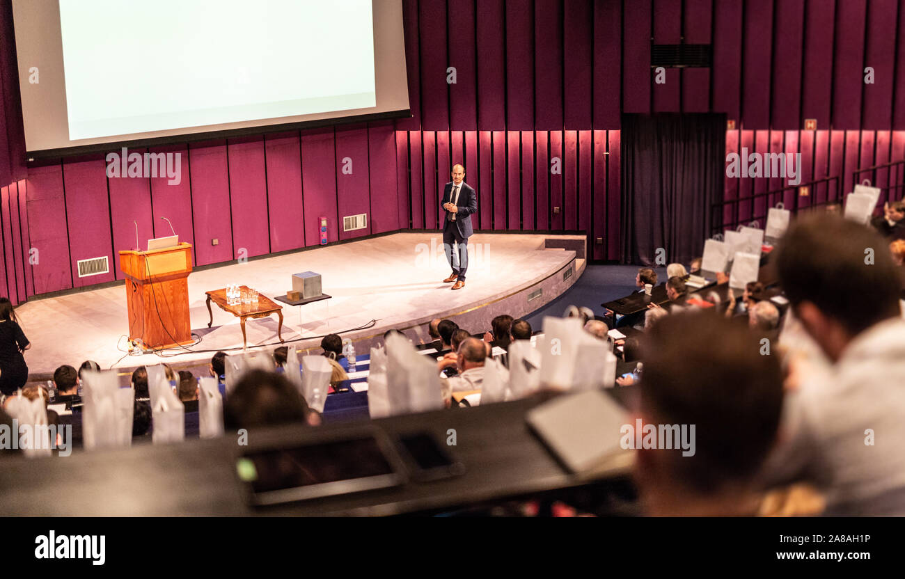 Speaker giving presentation on business conference event Stock Photo ...