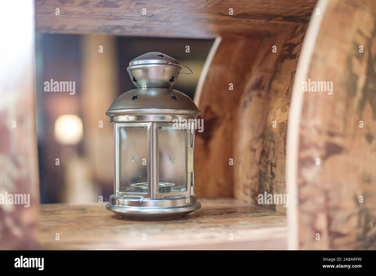 Lonely lantern on shelf in cafe. Christmas decor of restaurant with natural materials Stock ...