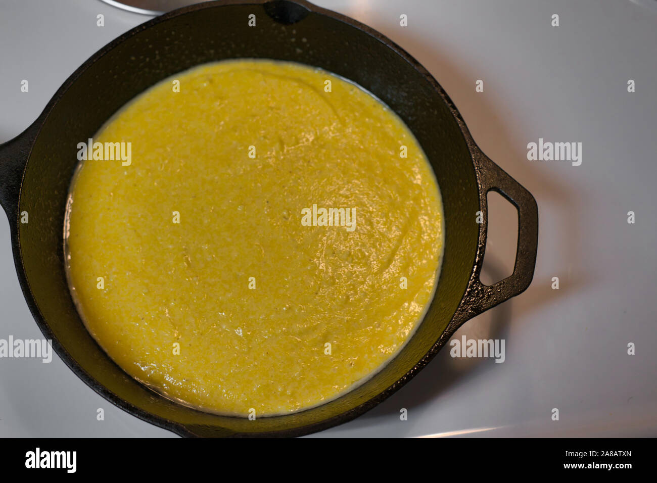 Corn bread cooked in a cast iron skillet is a southern classic. Add ...