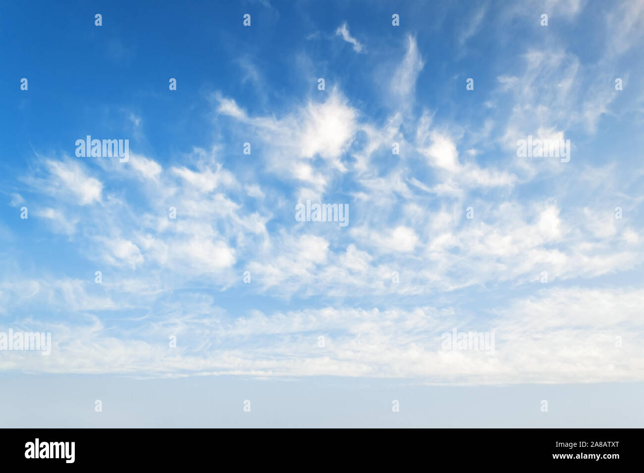 A lot of light semitransparent clouds floating high in a blue sky ...
