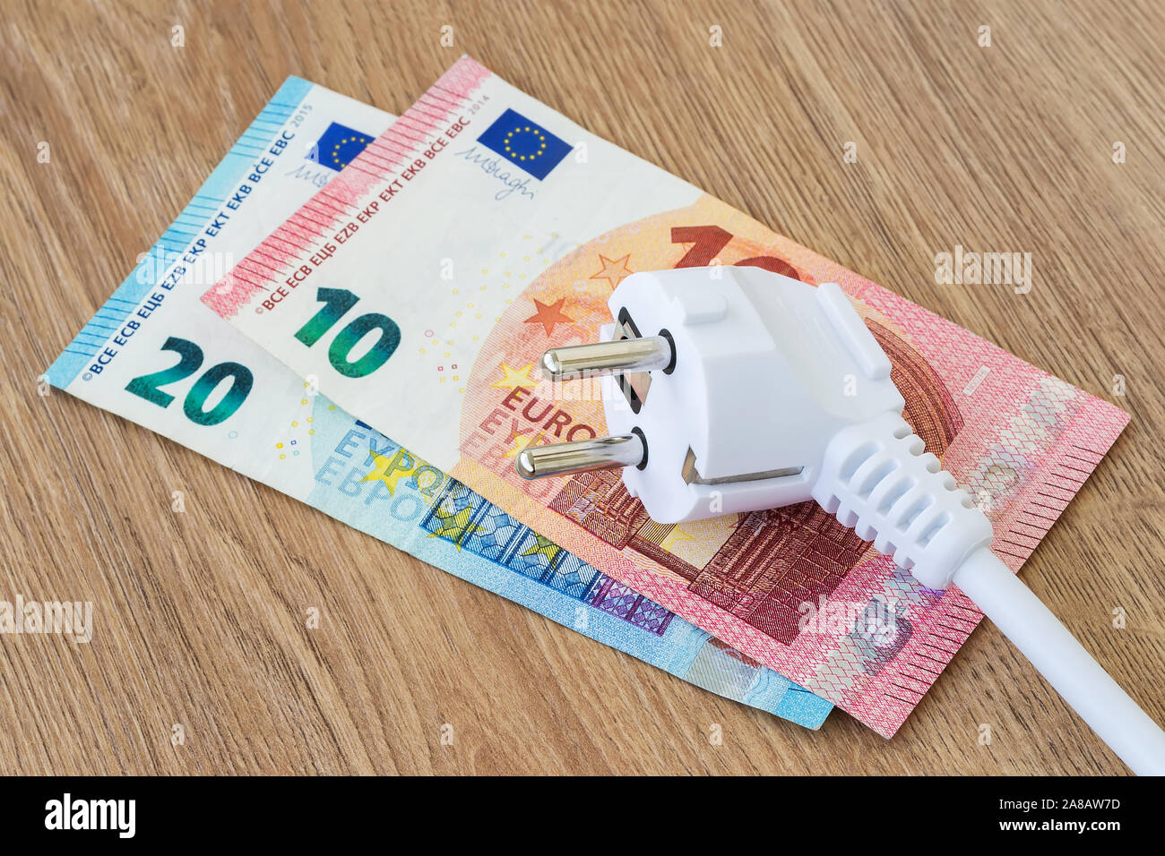 Banknotes coins plug wire hi-res stock photography and images - Alamy