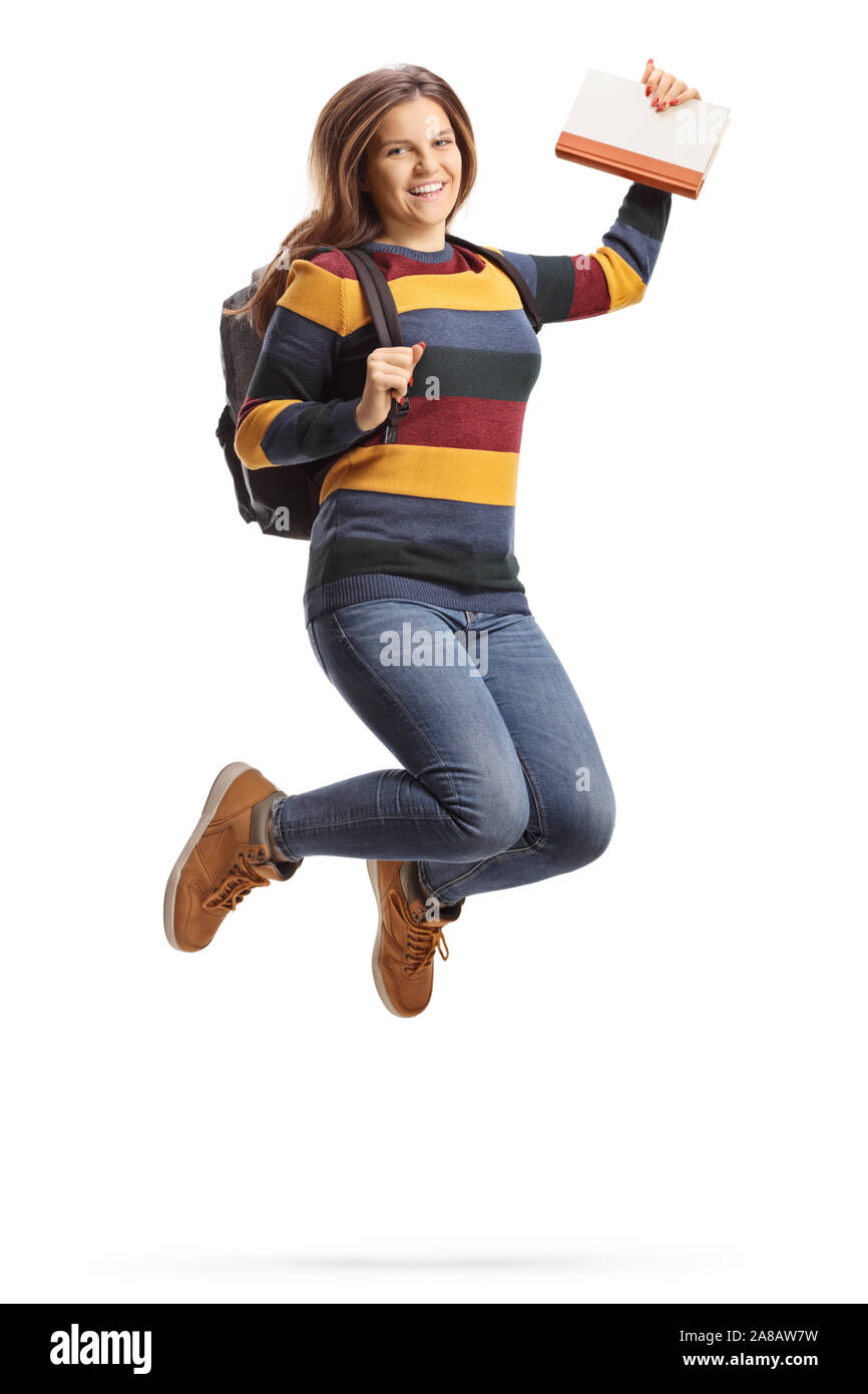Female student jumping and holding a book isolated on white background ...