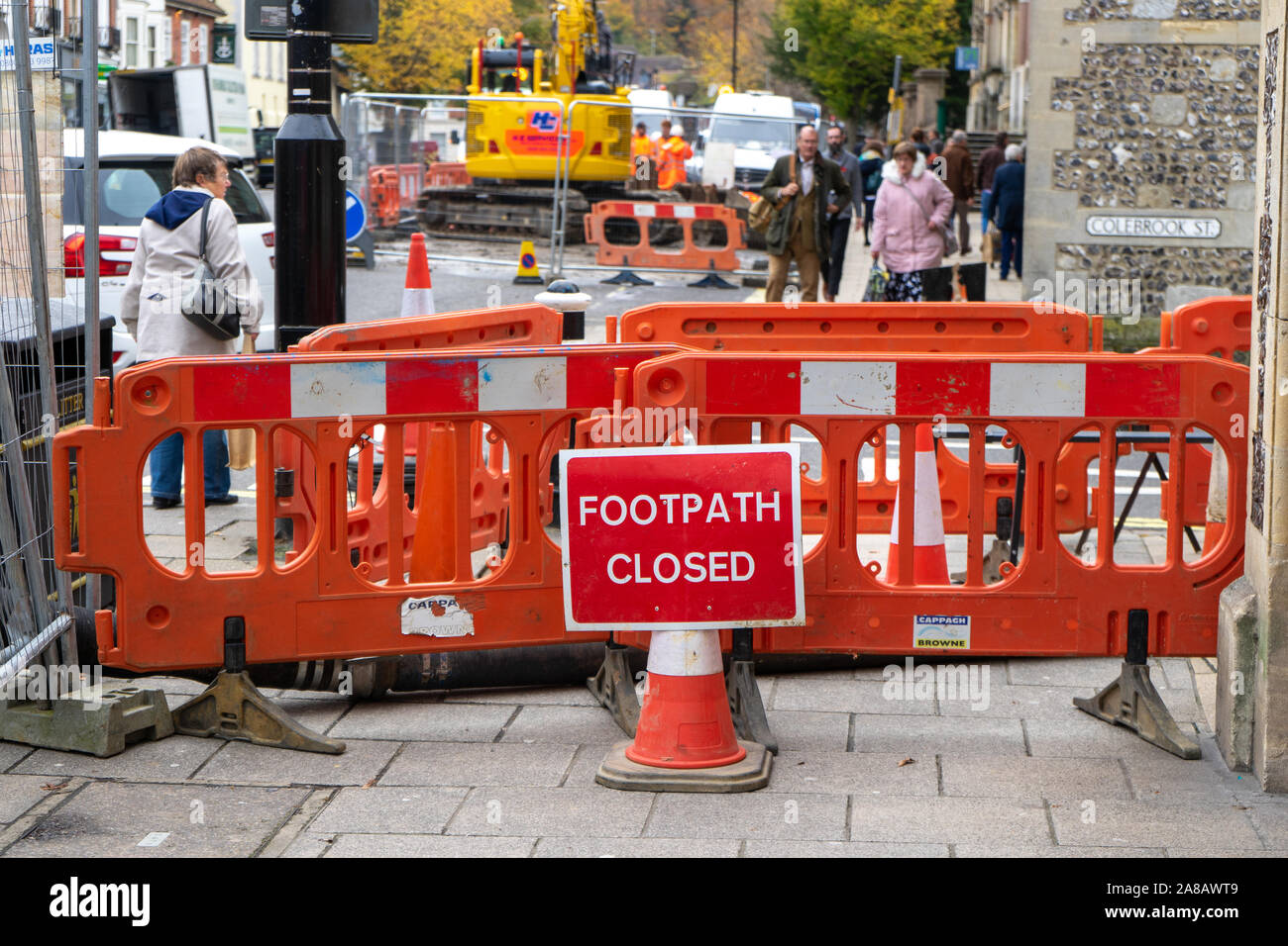 A footpath closed sign and barrier on a pavement Stock Photo - Alamy