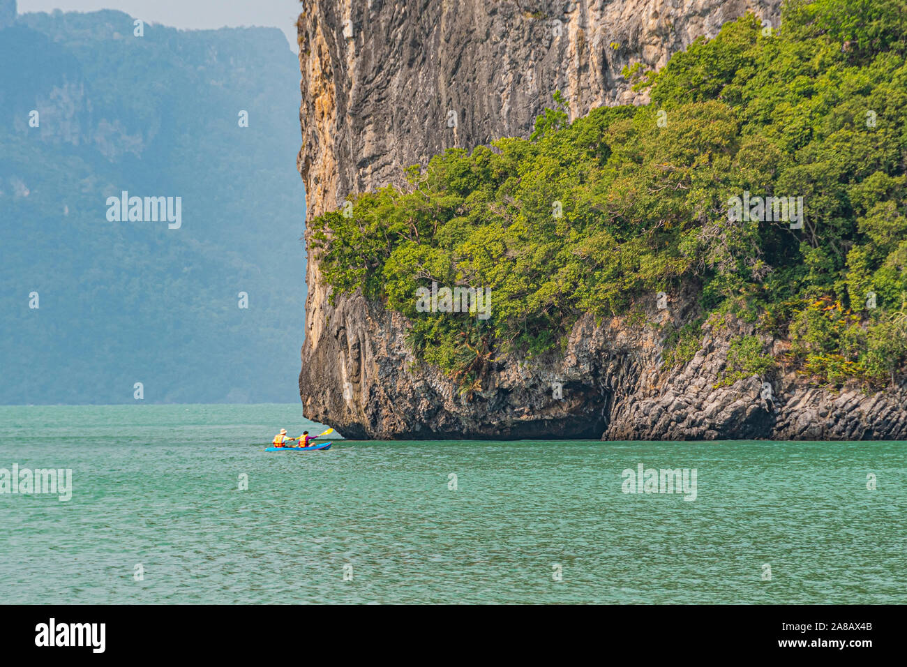 sailing between the islands with mountains of limestone formation in ...