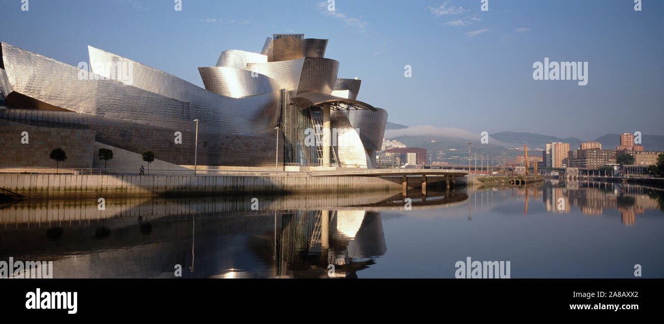 Reflection of a museum on water, Guggenheim Musuem, Bilbao, Spain Stock ...