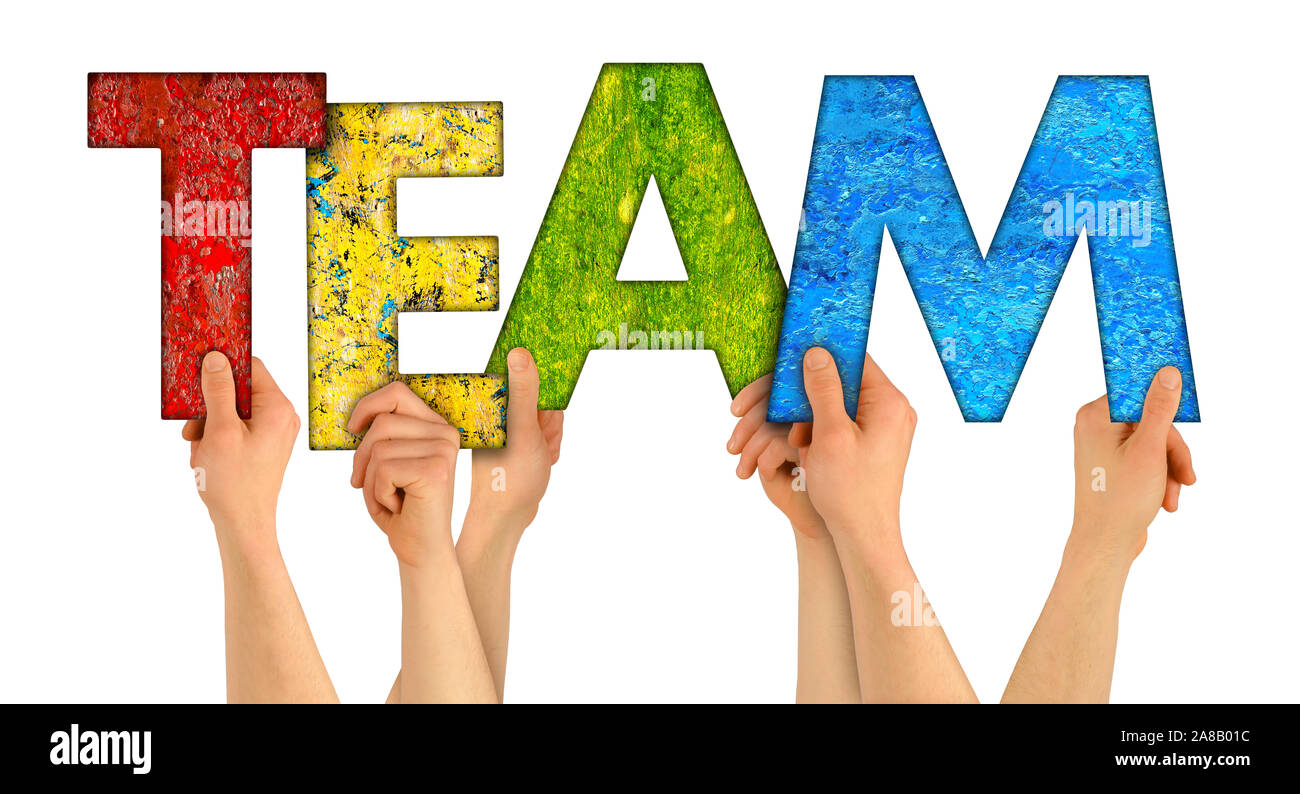 people holding up colorful rainbow wooden letter with words Team ...