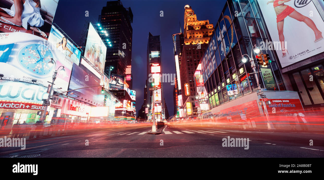 Low angle view of sign boards lit up at night, Times Square, New York ...