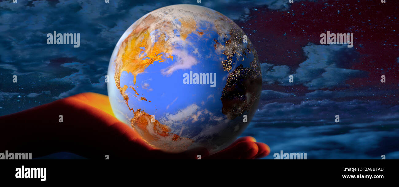 Close-up of a human hand holding a model of the earth Stock Photo - Alamy