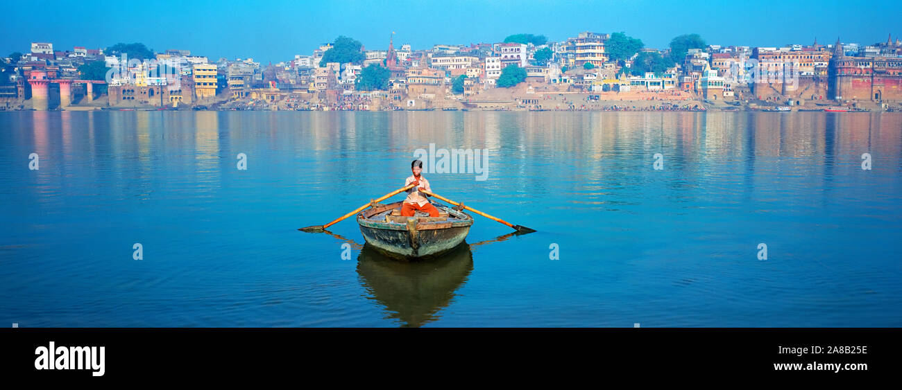 Young boy rowing a boat, Varanasi, Uttar Pradesh, India Stock Photo - Alamy
