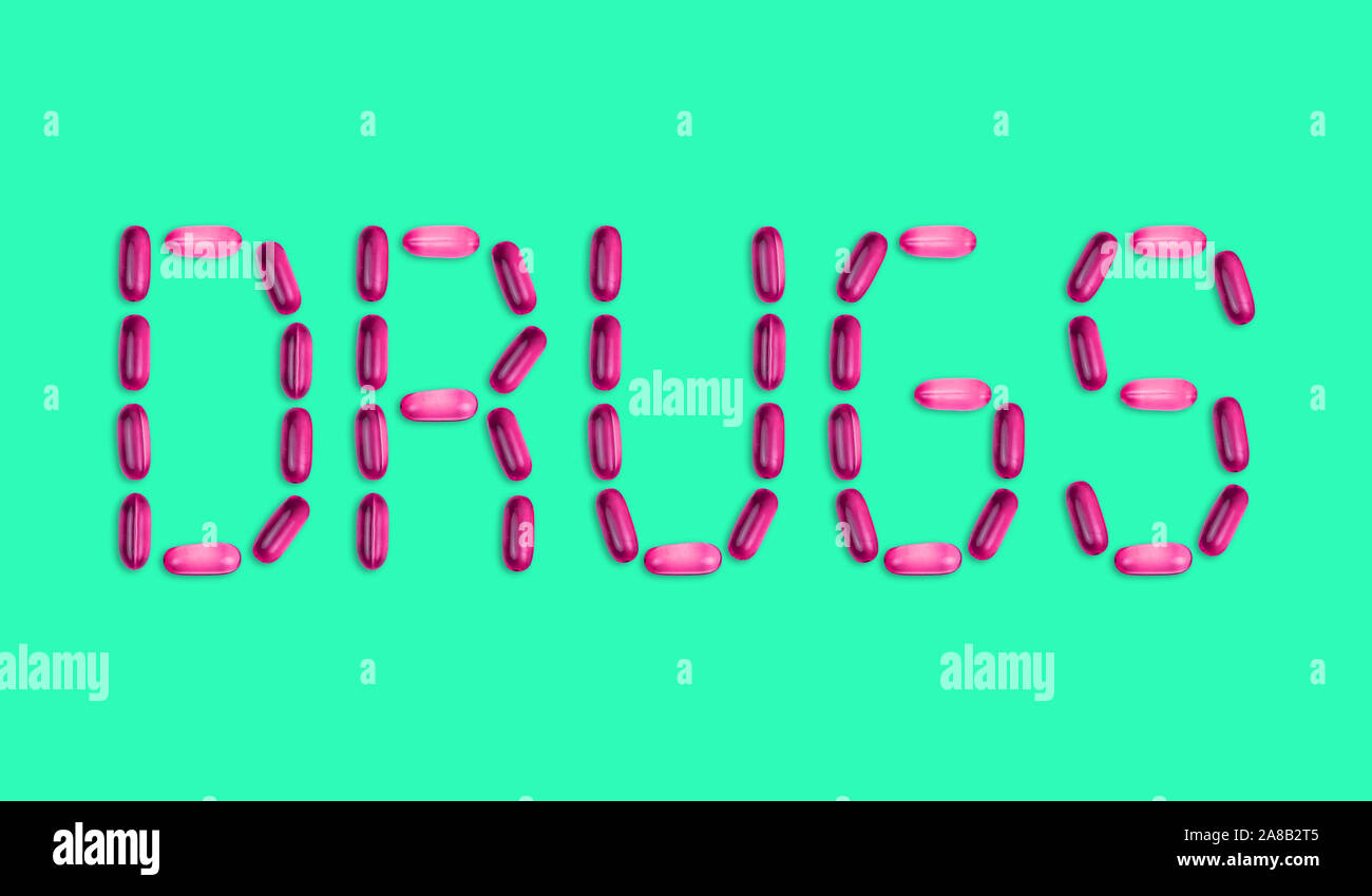The word Drugs is laid out with pills. The word Drugs is laid out with ...