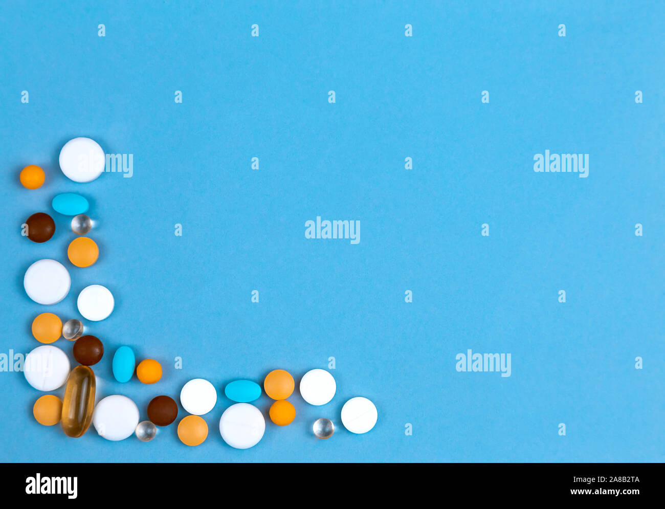 Pills Set As Border. Colored pills set as border on blue background ...