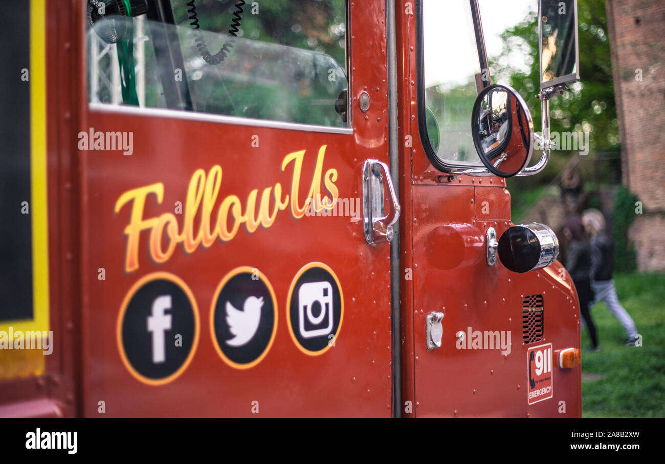 Follow us sign on bus Stock Photo - Alamy
