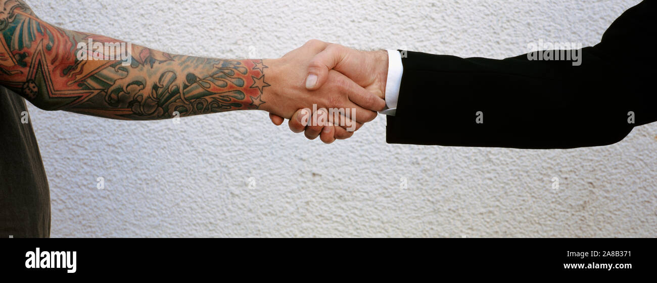 Close-Up Of Two Men Shaking Hands, Germany Stock Photo - Alamy