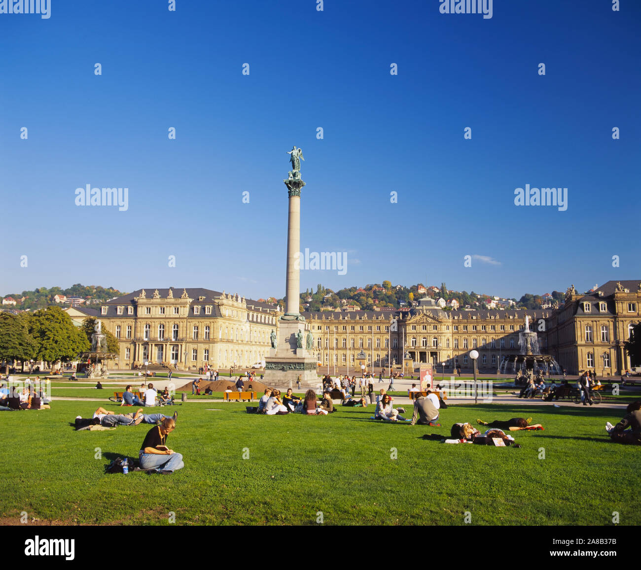 Group of people in a park, Schlossplatz, Stuttgart, Baden-Wurttemberg ...
