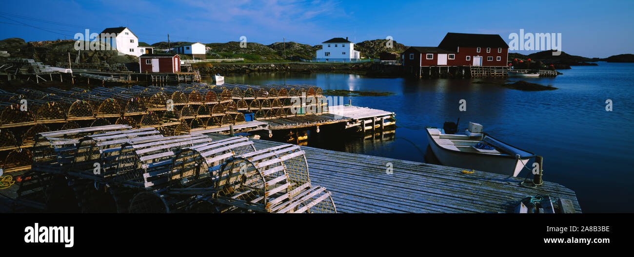 Stack of lobster traps at a dock, Change Islands, Newfoundland ...
