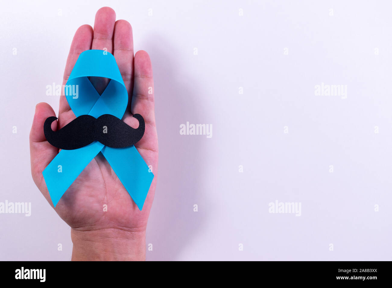Prostate Cancer Awareness, Man holding light Blue Ribbon with mustache ...