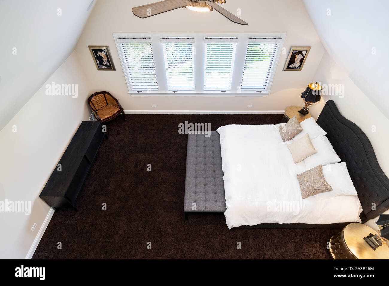 Looking down over a master bedroom from an above floor Stock Photo - Alamy