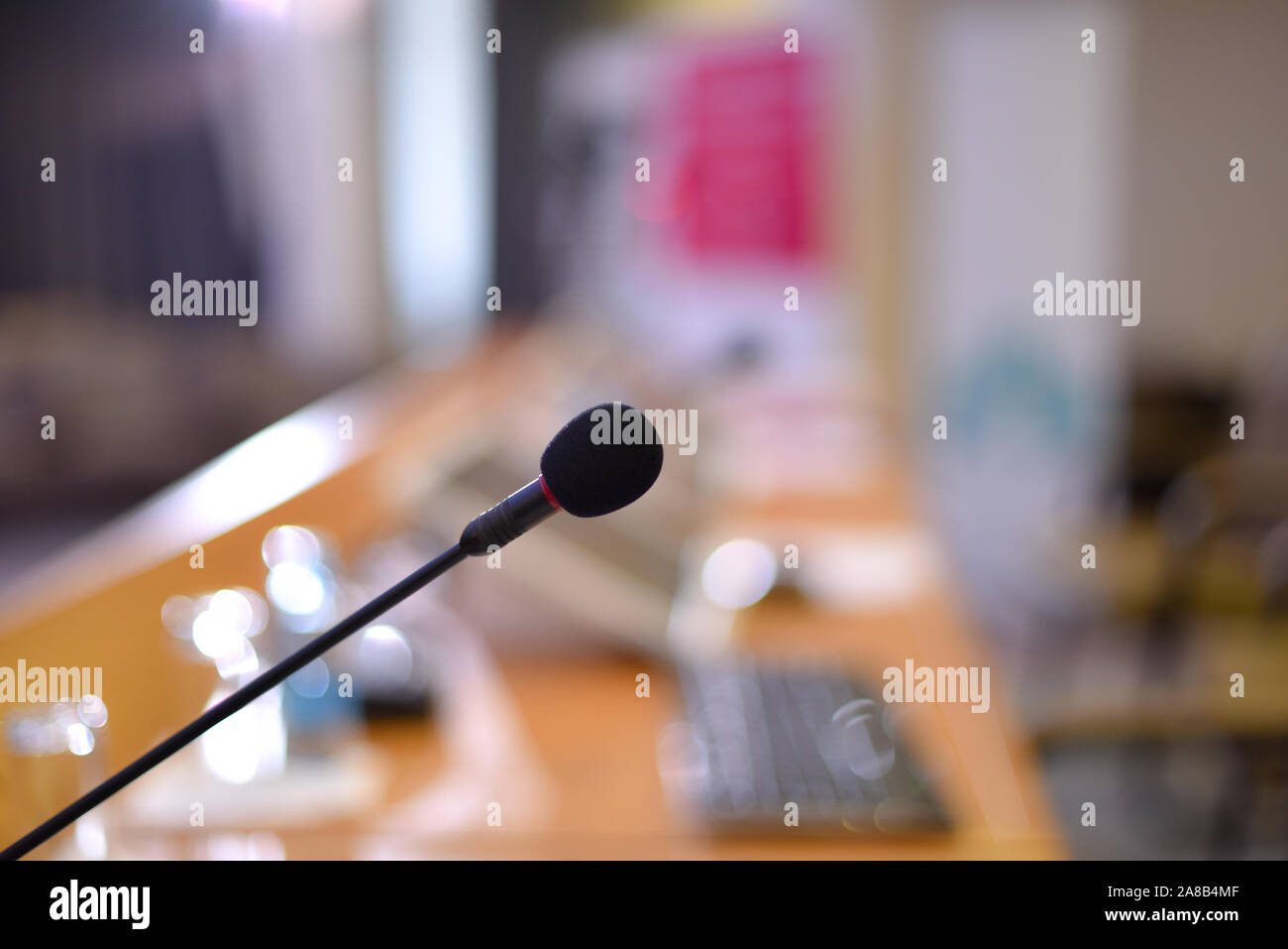 Microphones and monitors at conference hall during business conference ...