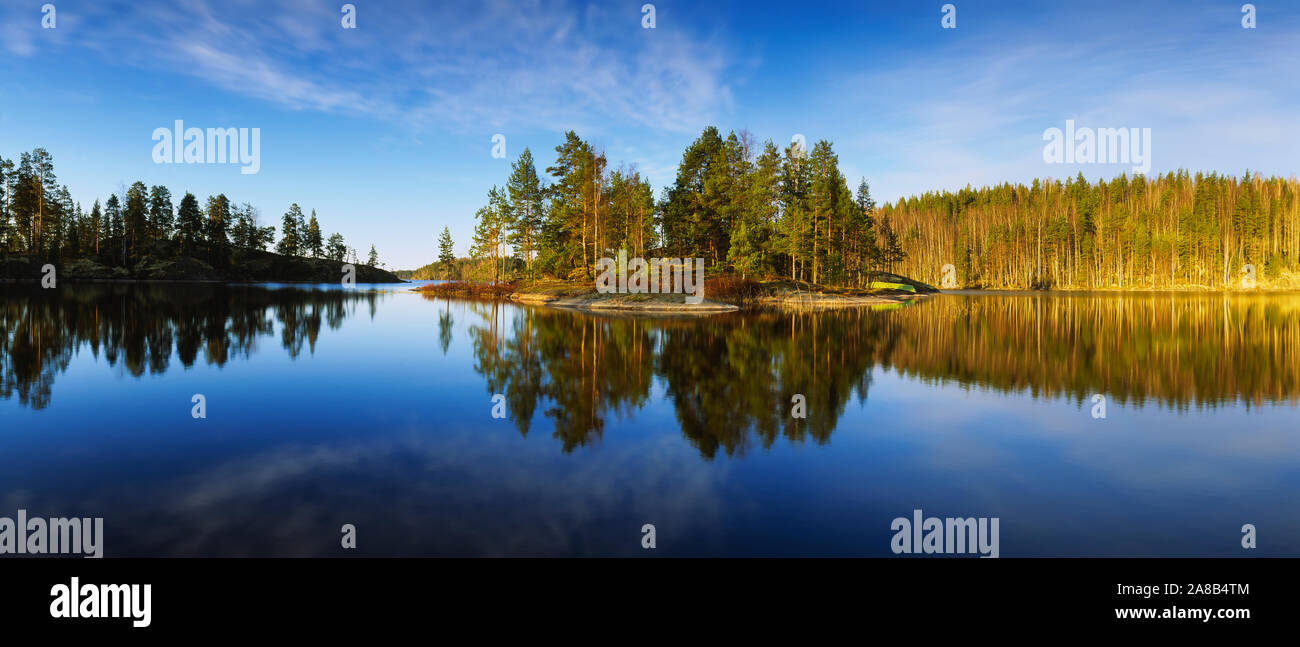 Reflection of trees in a lake, Lake Saimaa, Puumala, Finland Stock ...