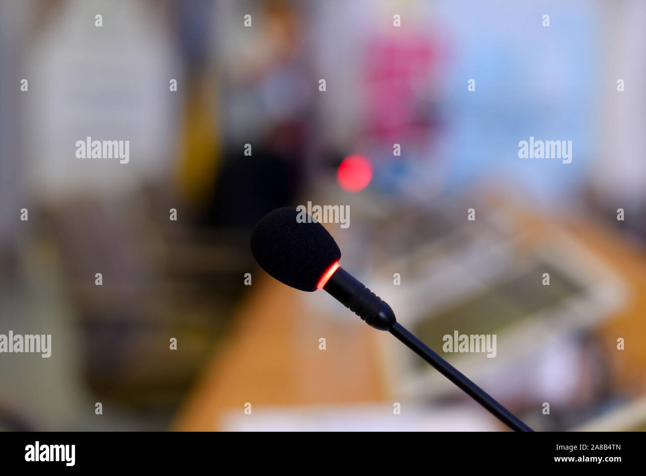 Microphones and monitors at conference hall during business conference ...