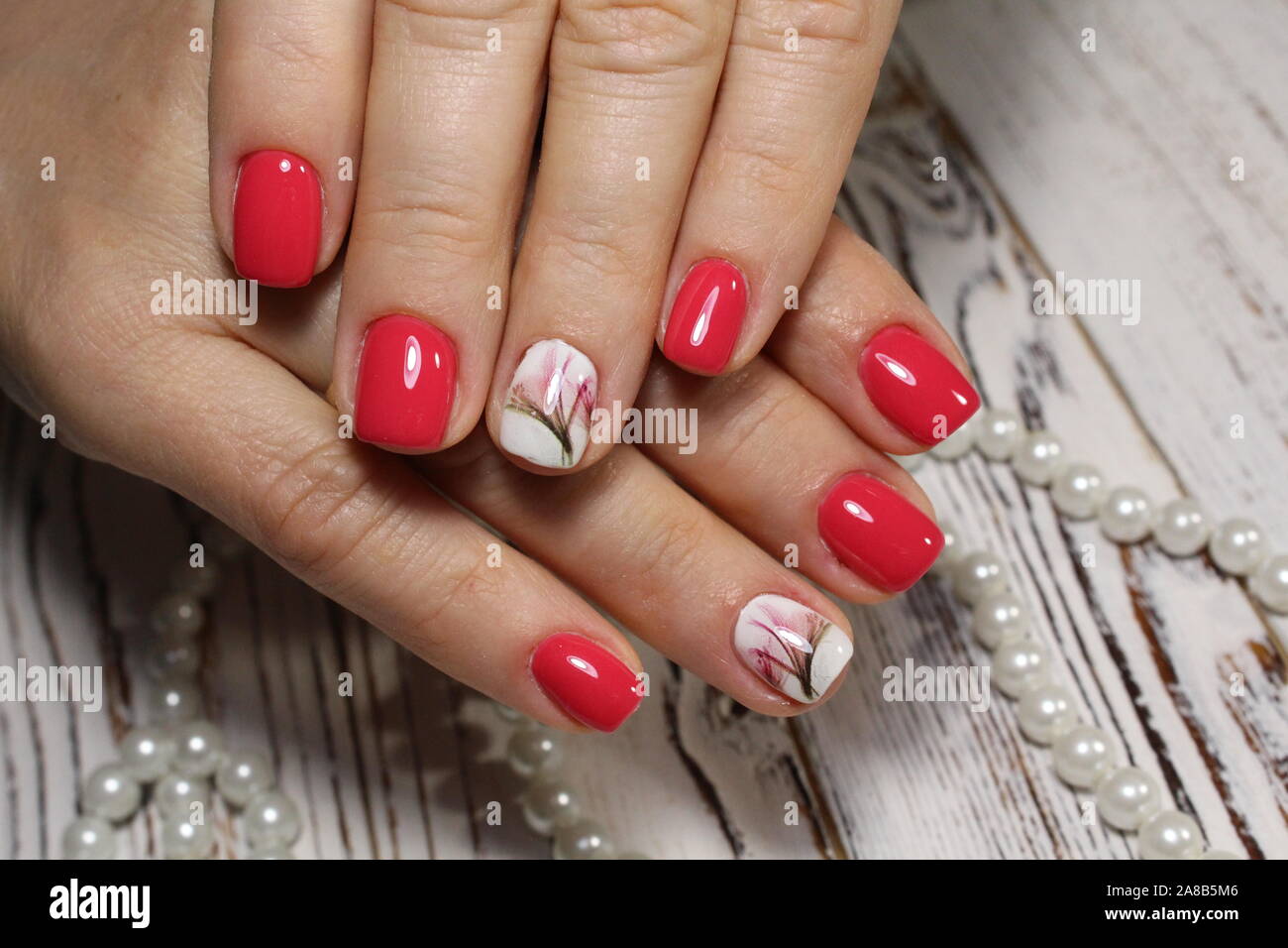 beautiful female hands with a fashionable manicure on the background ...