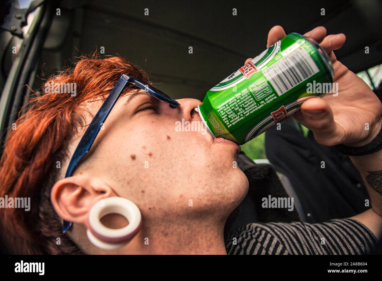 Boy drinking can hi-res stock photography and images - Alamy