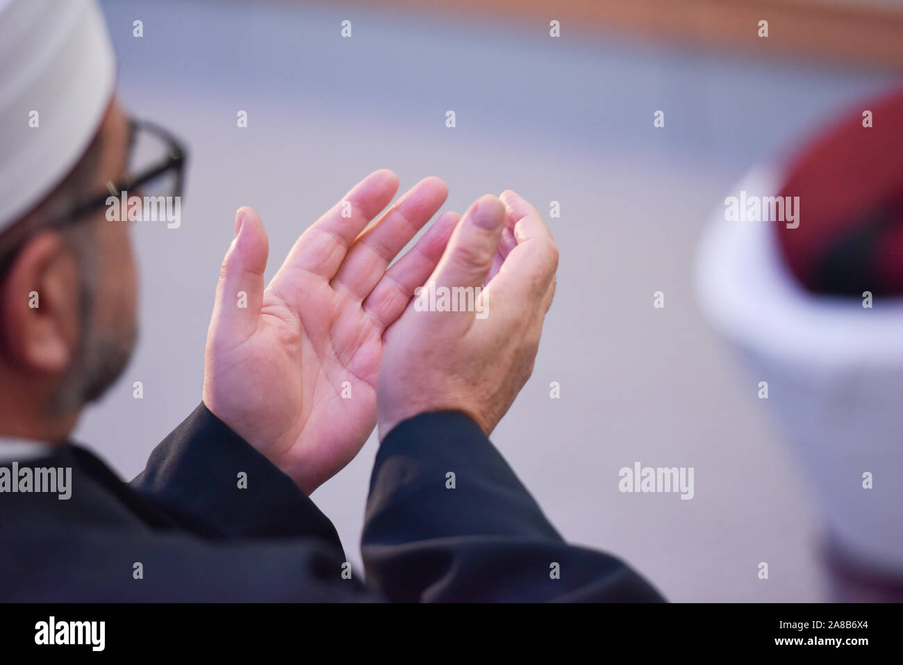 Elderly Muslim Arabic man praying during islamic conference Stock Photo ...