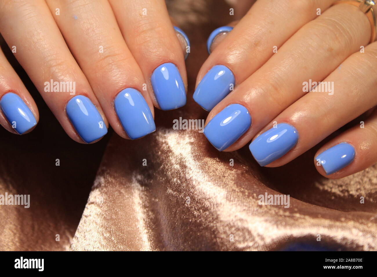 beautiful blue manicure on a beautiful textural background Stock Photo ...
