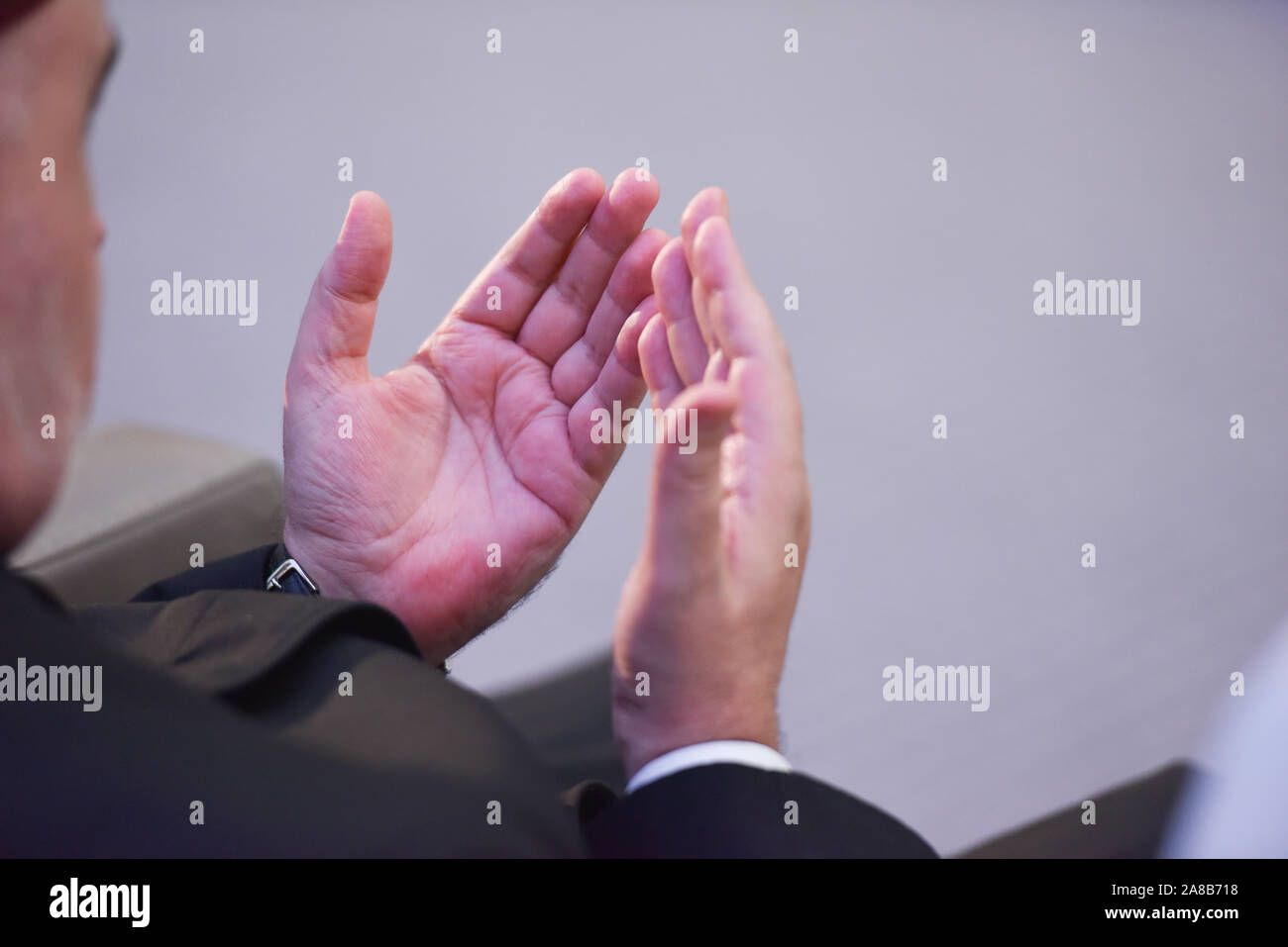 Elderly Muslim Arabic man praying during islamic conference Stock Photo ...