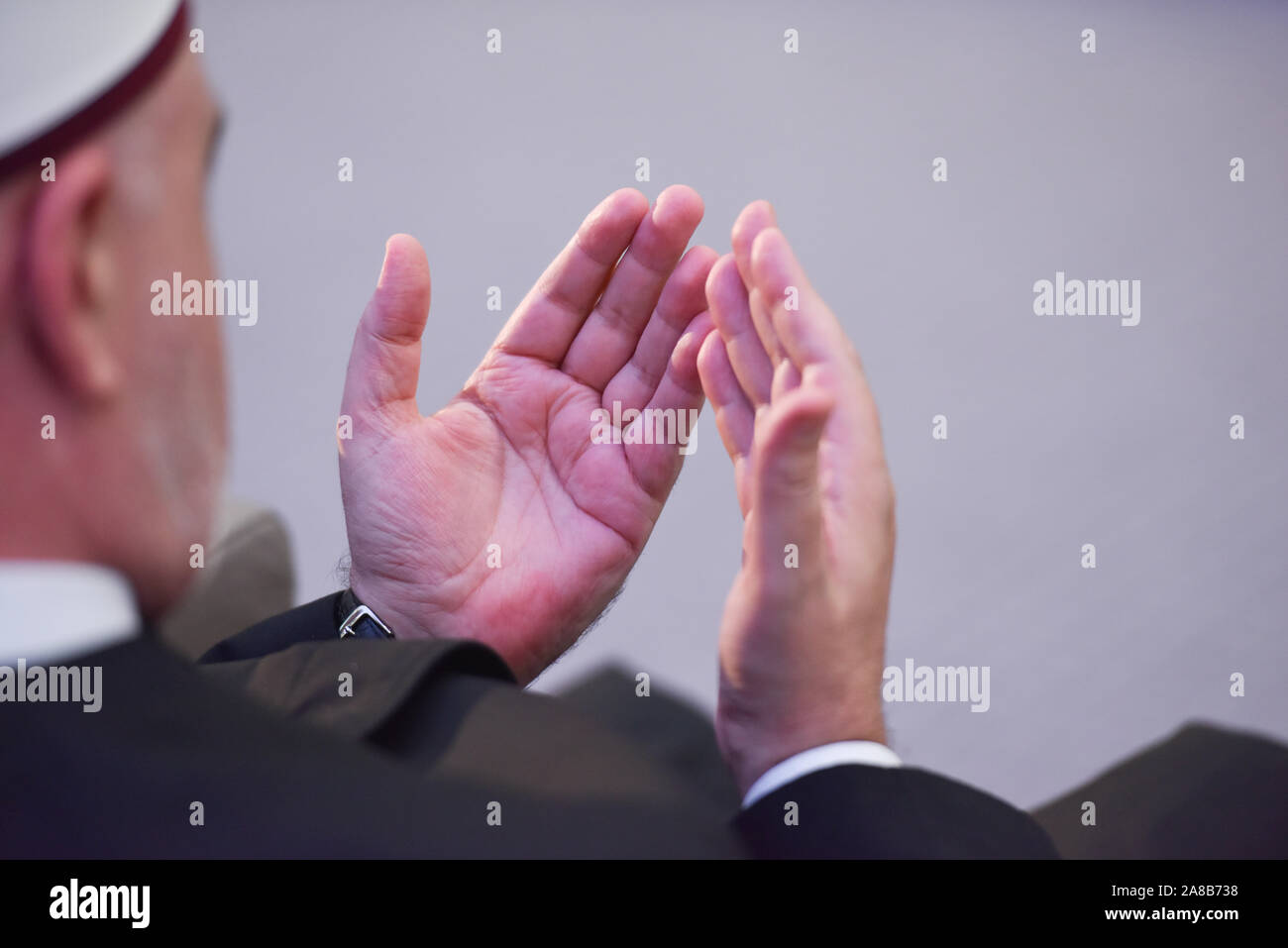 Elderly Muslim Arabic man praying during islamic conference Stock Photo ...