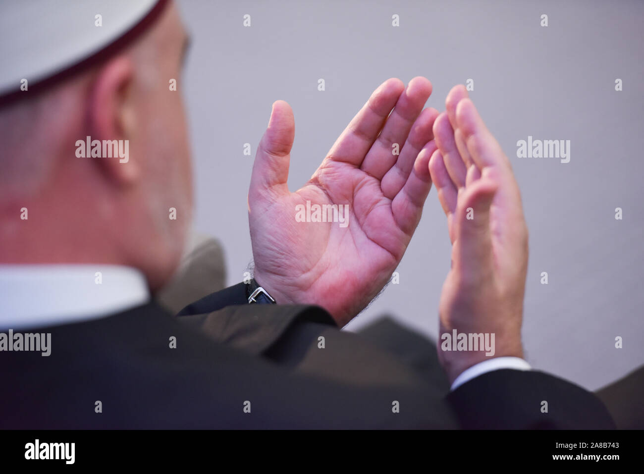 Elderly Muslim Arabic man praying during islamic conference Stock Photo ...