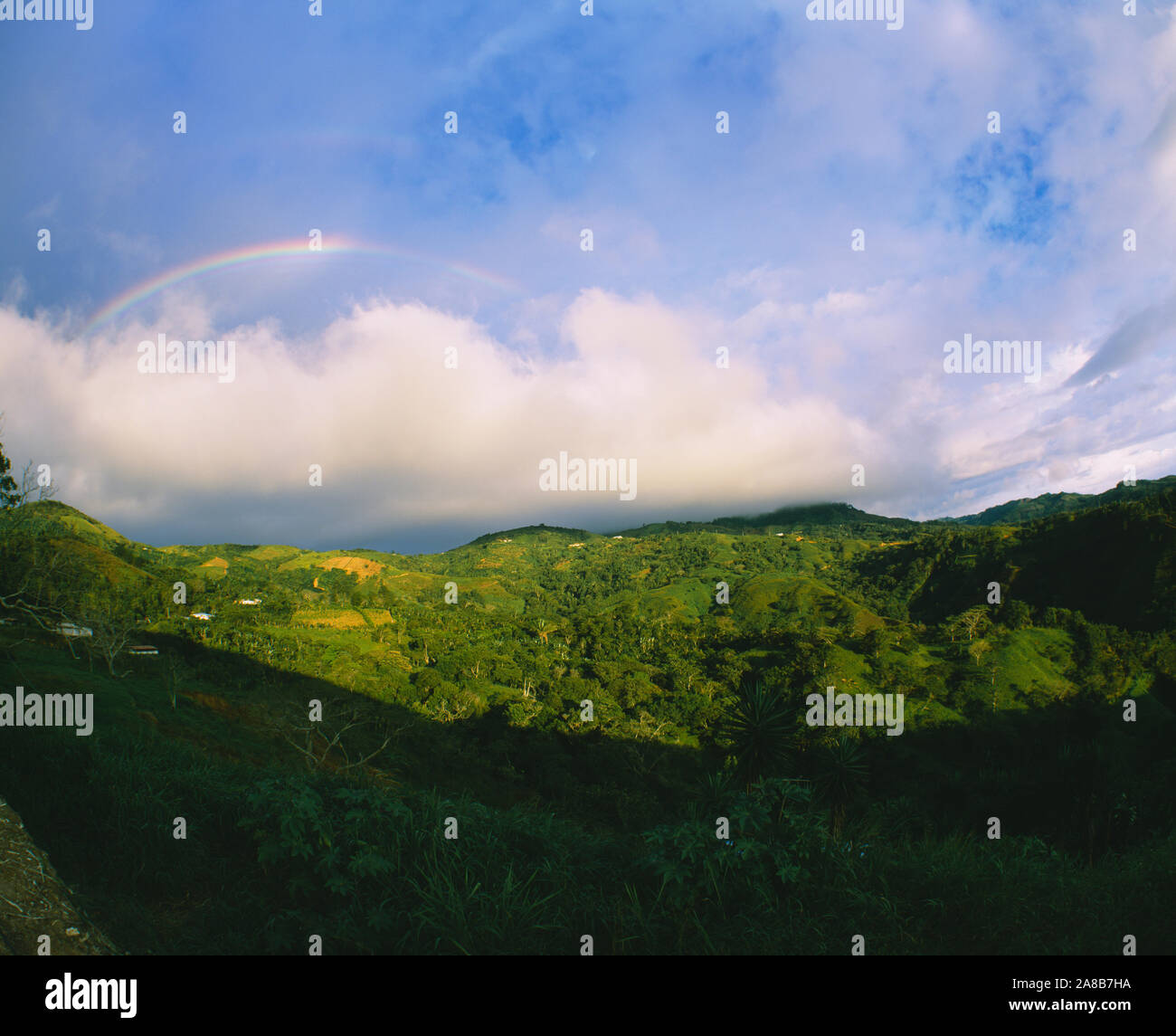 Clouds and rainbow over a mountain, Costa Rica Stock Photo - Alamy